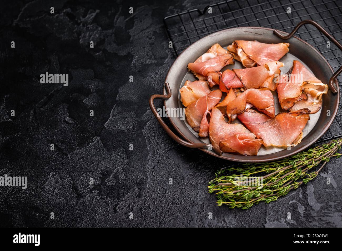 Italian Cured Prosciutto crudo ham. black background. top view Stock ...