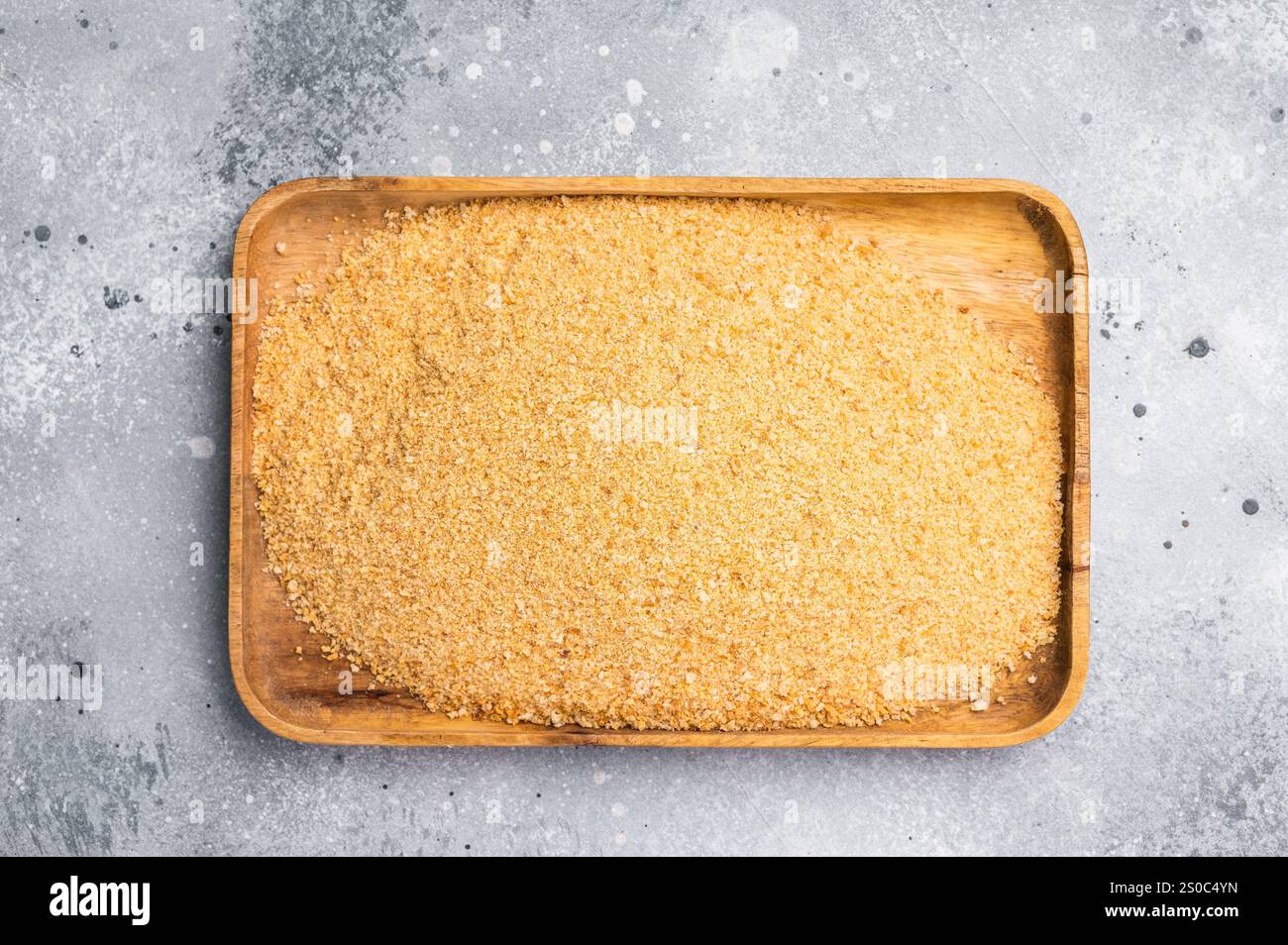 Homemade organic bread crumbs in a wooden tray. gray background. top ...