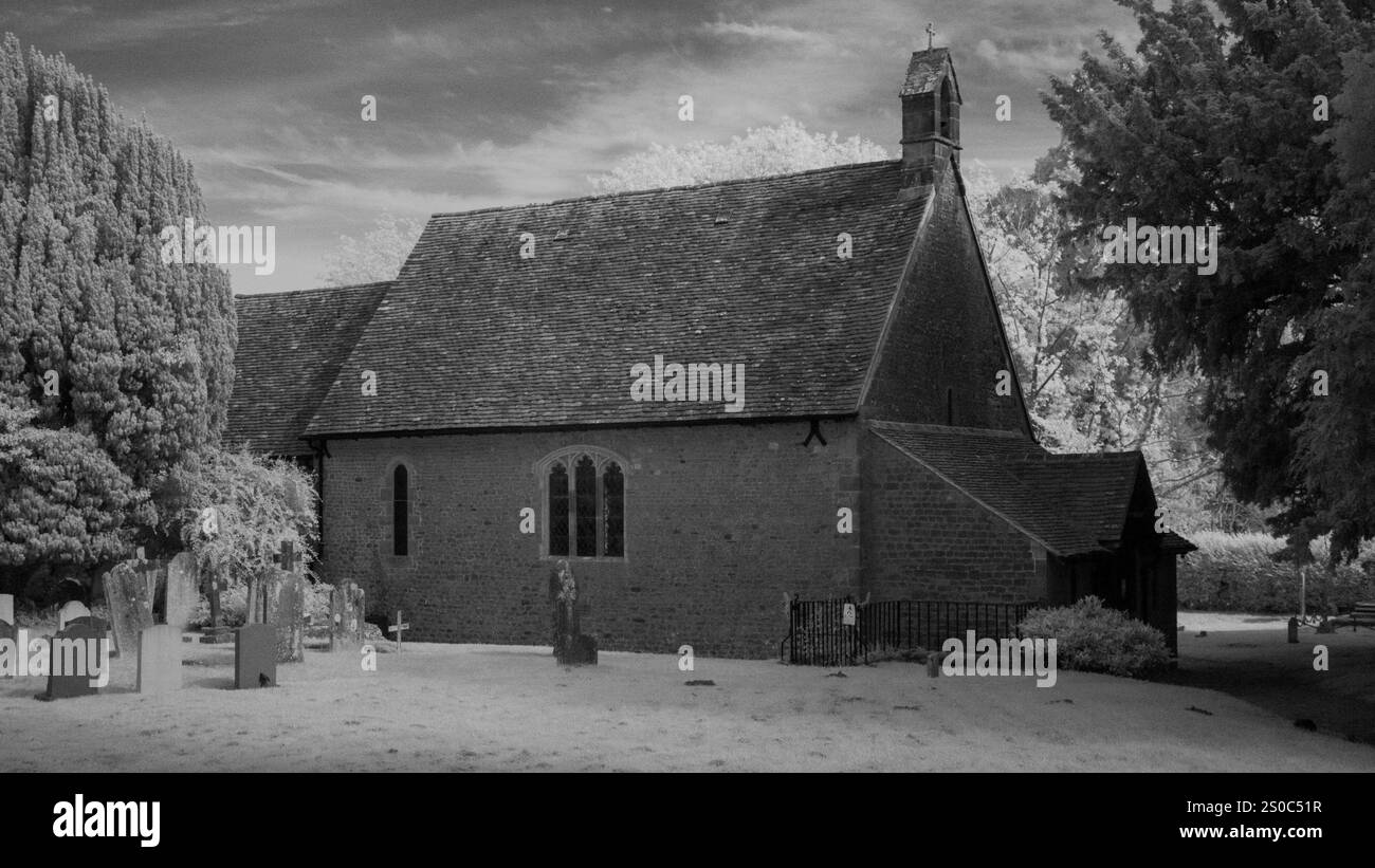Terwick, UK - June 17, 2024: St Peter's Chapel and the Lupin field ...