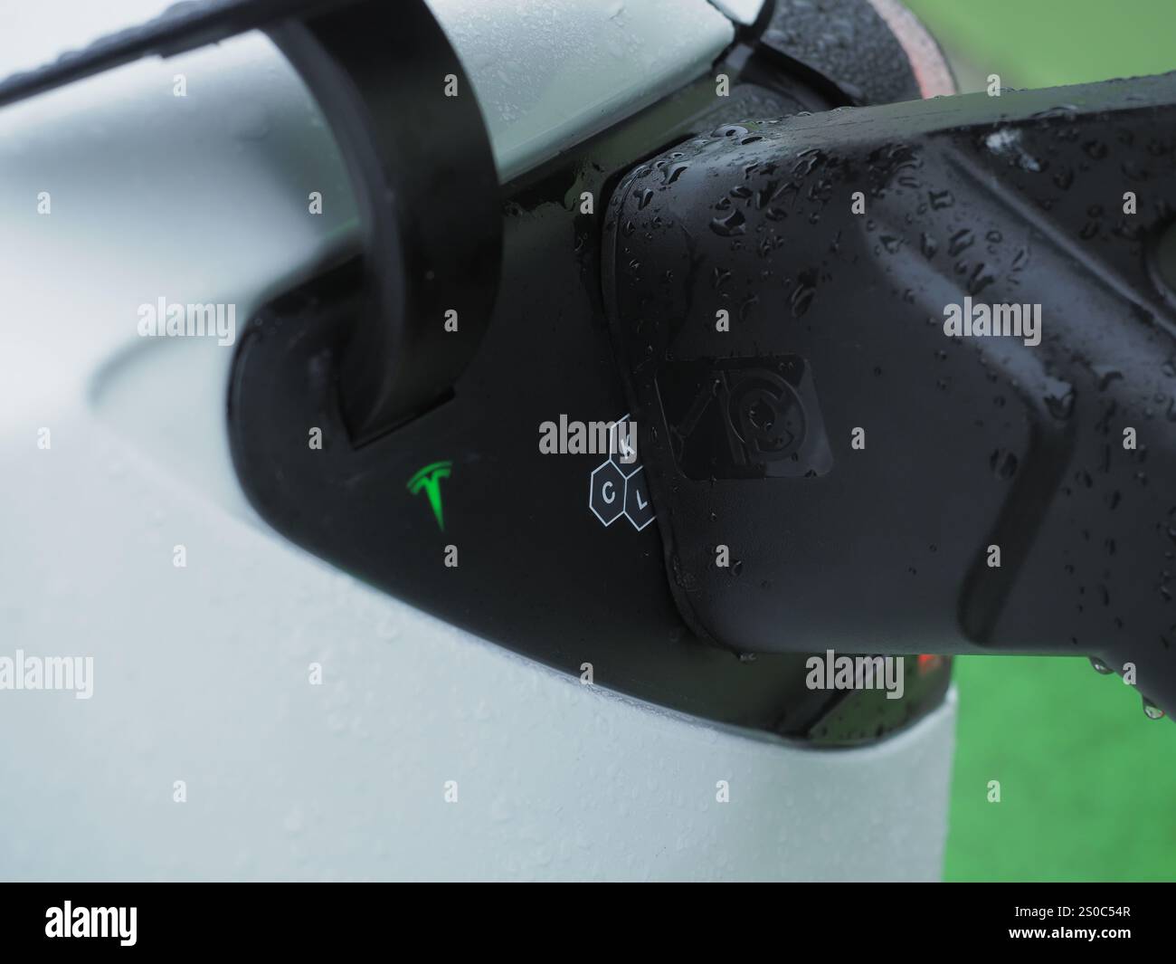 Galati, Romania - December 26, 2024: Tesla charging port connected to a ...