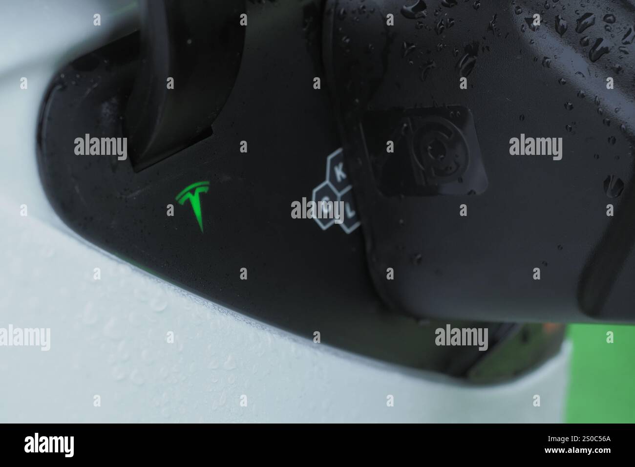 Galati, Romania - December 26, 2024: Tesla charging port connected to a ...