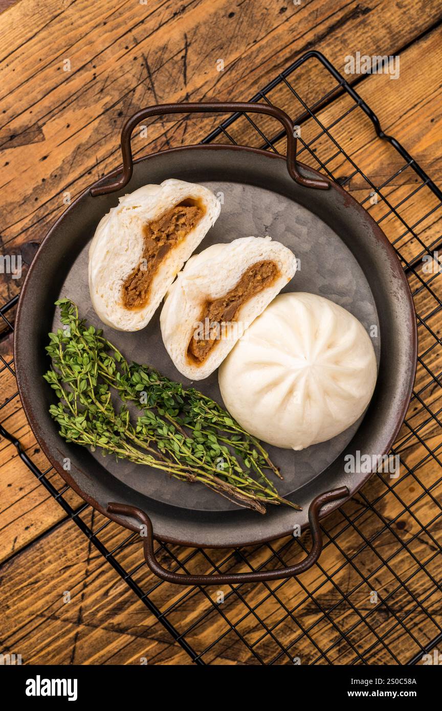 Chinese Bao Baozi steam bun with meat on steel tray. wooden background ...