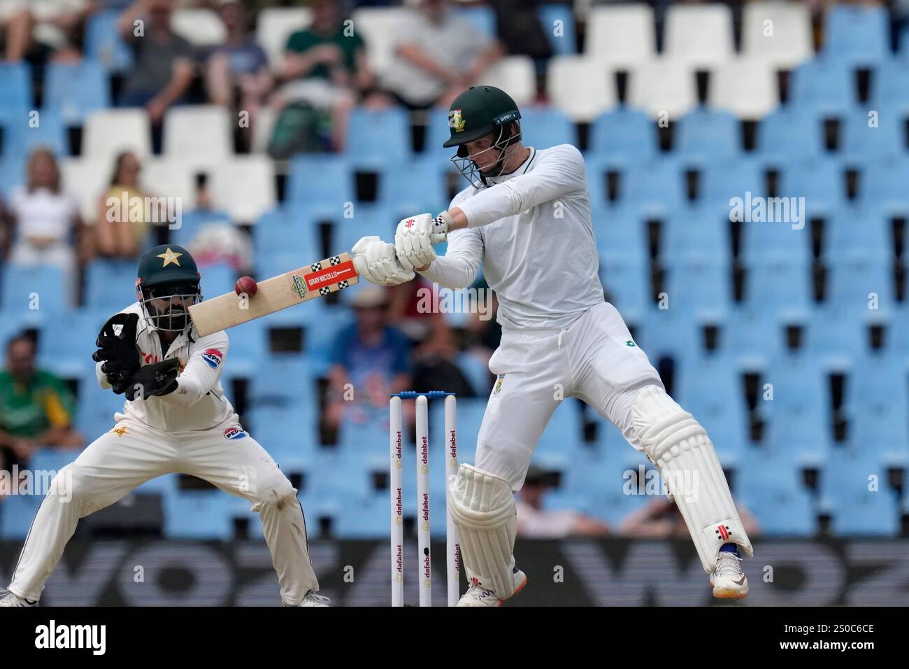 South Africa's Corbin Bosch, right, plays a shot whilst Pakistan's ...