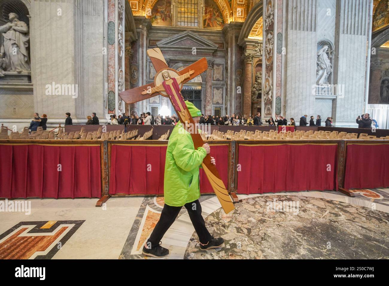 Vatican, Rome, Italy. 27 December 2024 Pilgrims carry the cross to the ...