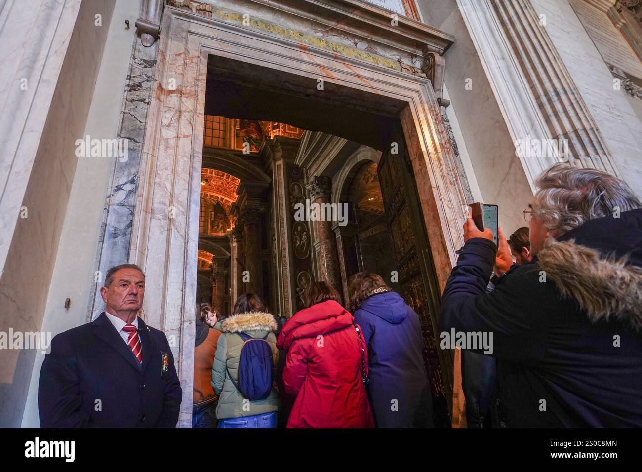 Vatican, Rome, Italy. 27 December 2024 Visitors and pilgrims pass ...