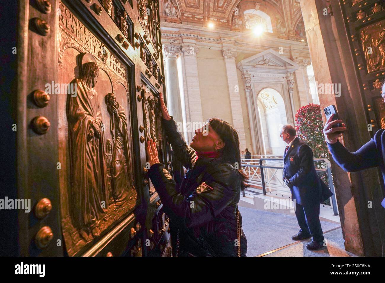 Vatican, Rome, Italy. 27 December 2024 Visitors and pilgrims pass ...