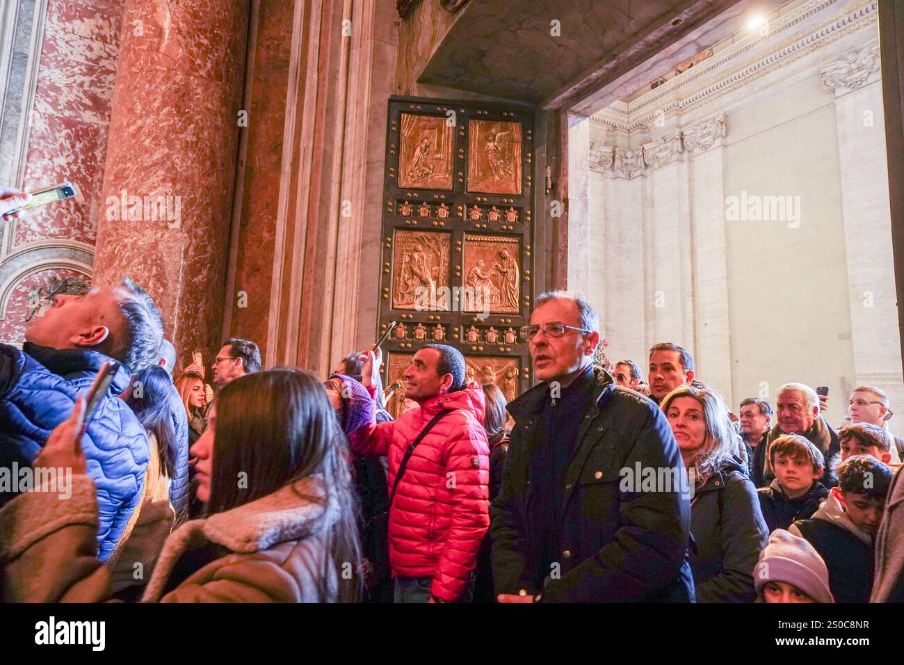 Vatican, Rome, Italy. 27 December 2024 Visitors and pilgrims pass ...