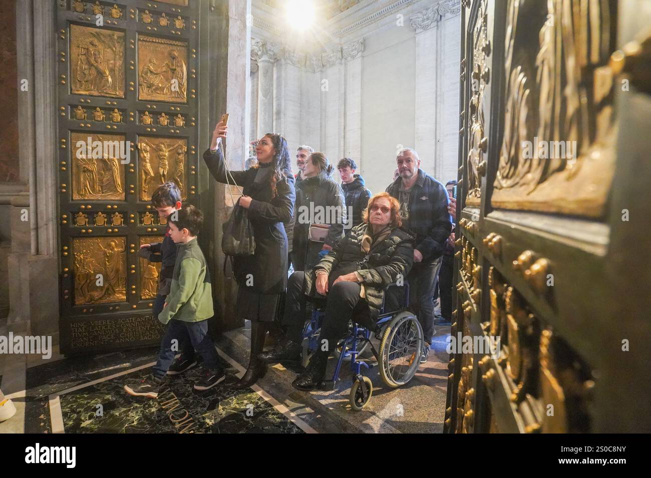 Vatican, Rome, Italy. 27 December 2024 Visitors and pilgrims pass ...