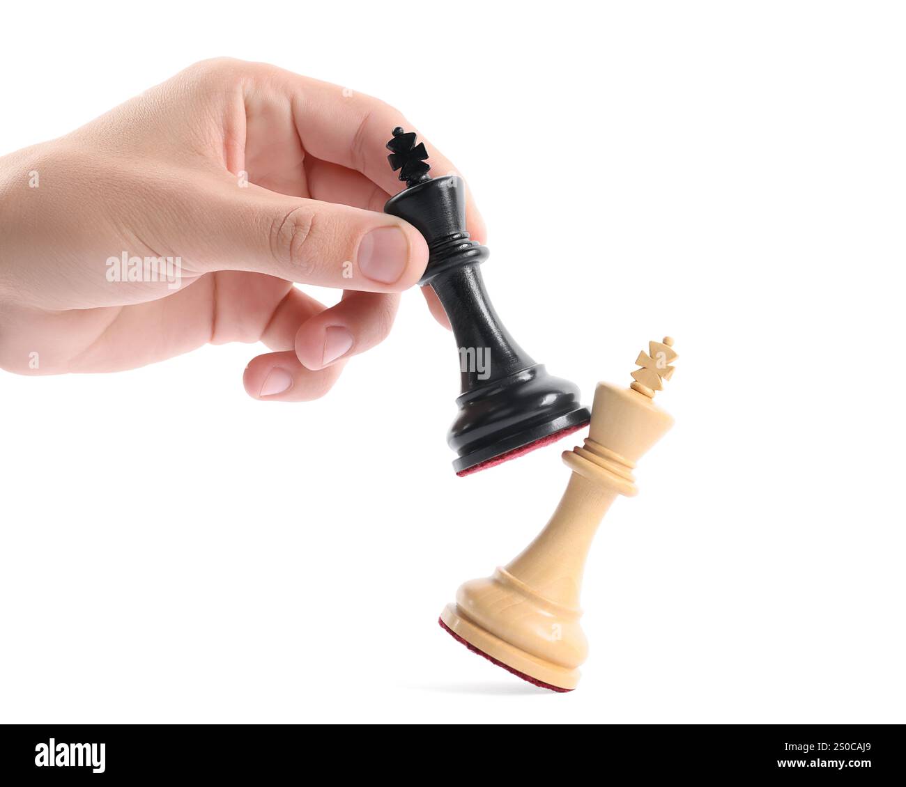 Man with black chess king knocking over white one on white background ...
