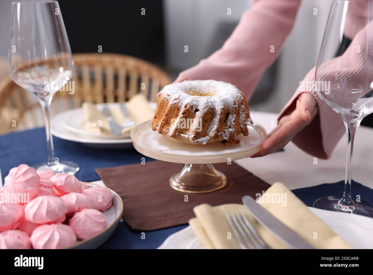 Woman setting table for dinner at home, closeup Stock Photo - Alamy