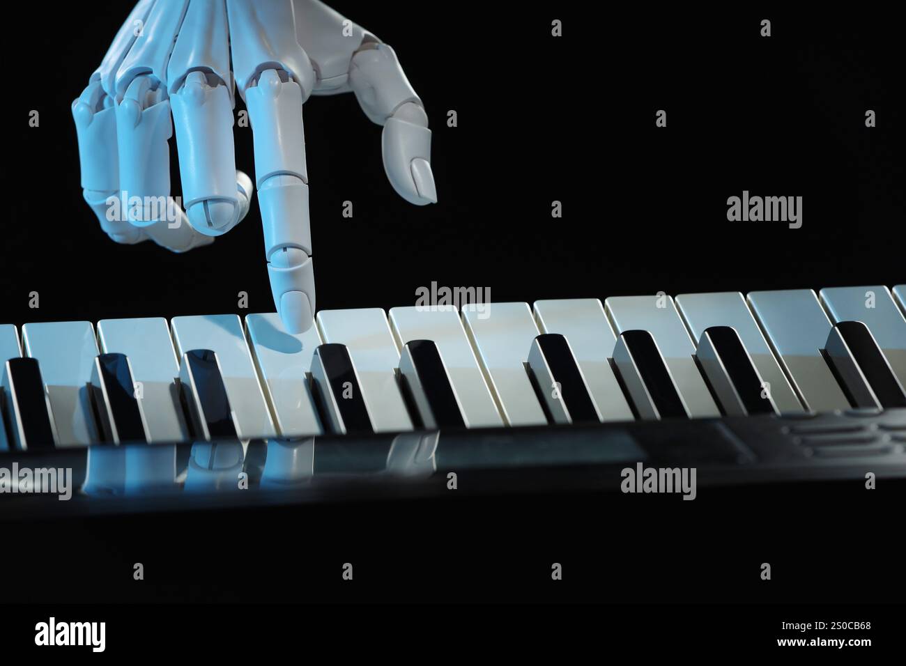 Artificial intelligence. Robot hand playing synthesizer on black ...