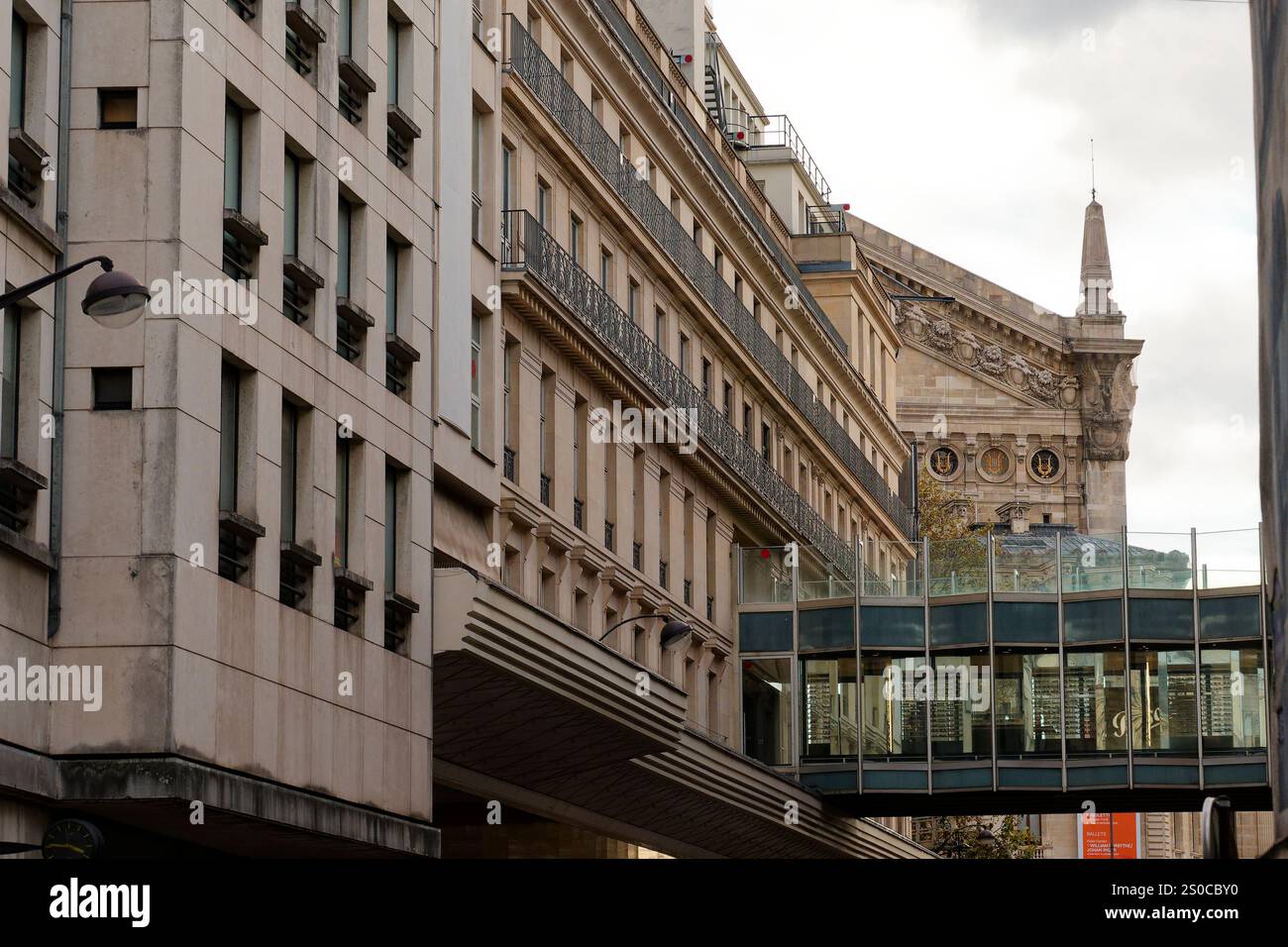Modern architecture contrasts with historic buildings in a bustling ...