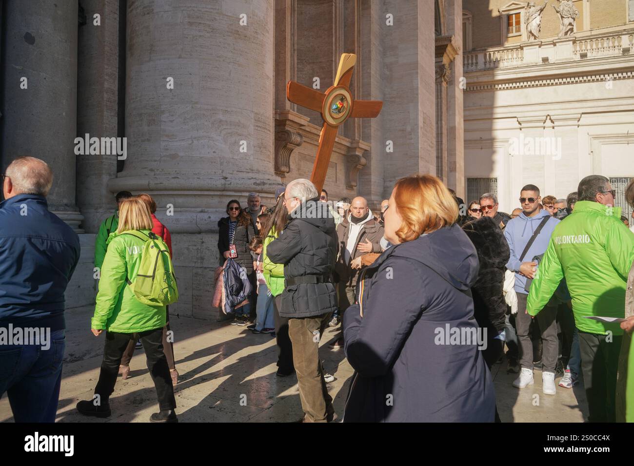 Vatican, Rome, Italy. 27 December 2024 Pilgrims carry the cross as they ...