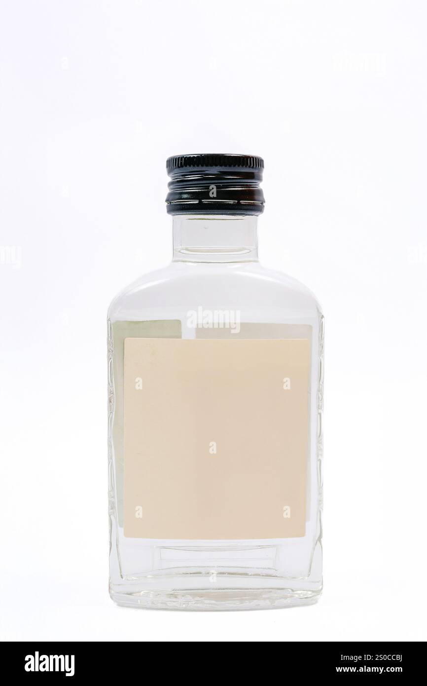a small glass bottle with a clear liquid. a small bottle of Russian ...