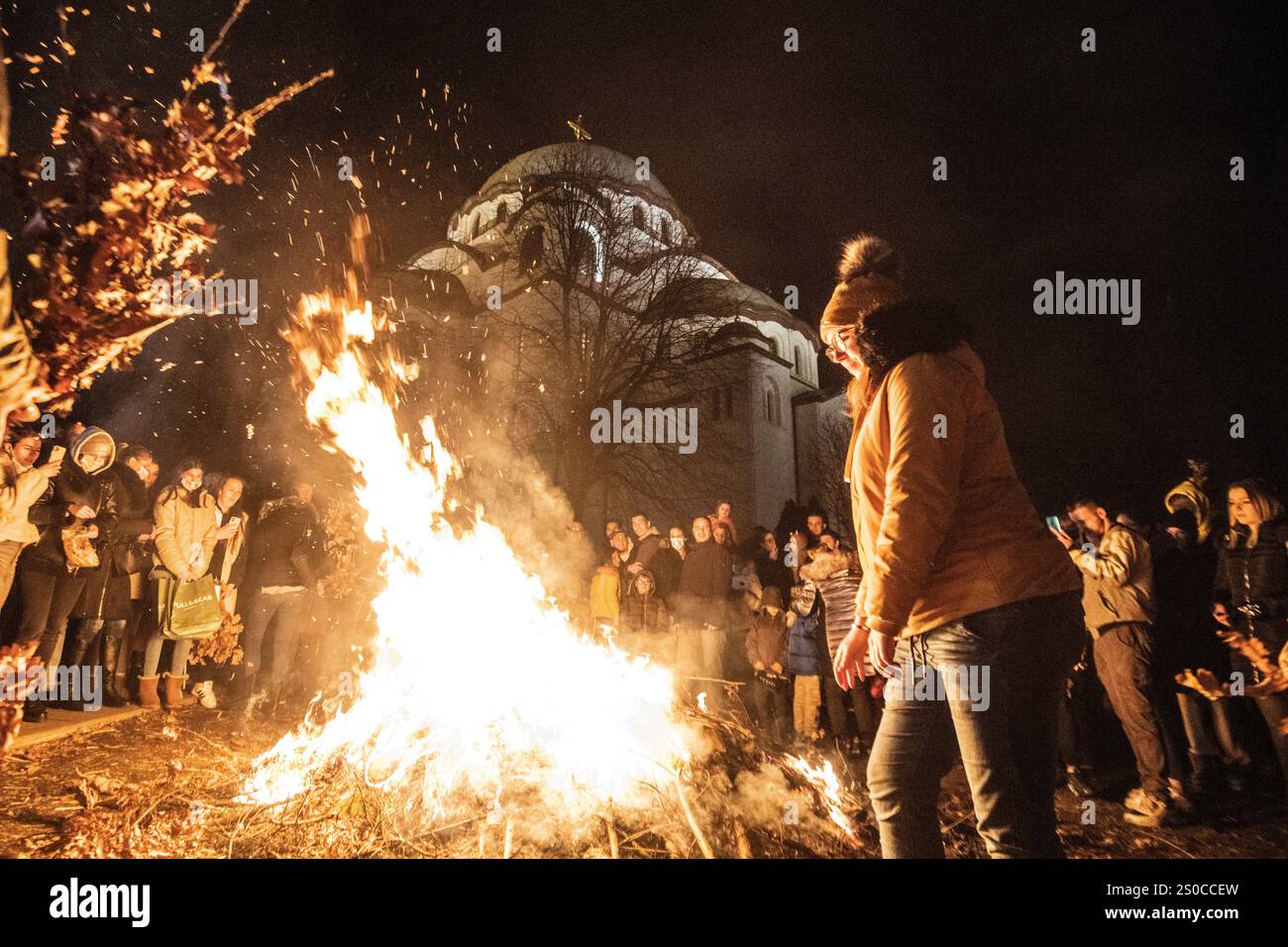 Traditional bonfire during Orthodox Christmas Eve. Temple of Saint Sava ...