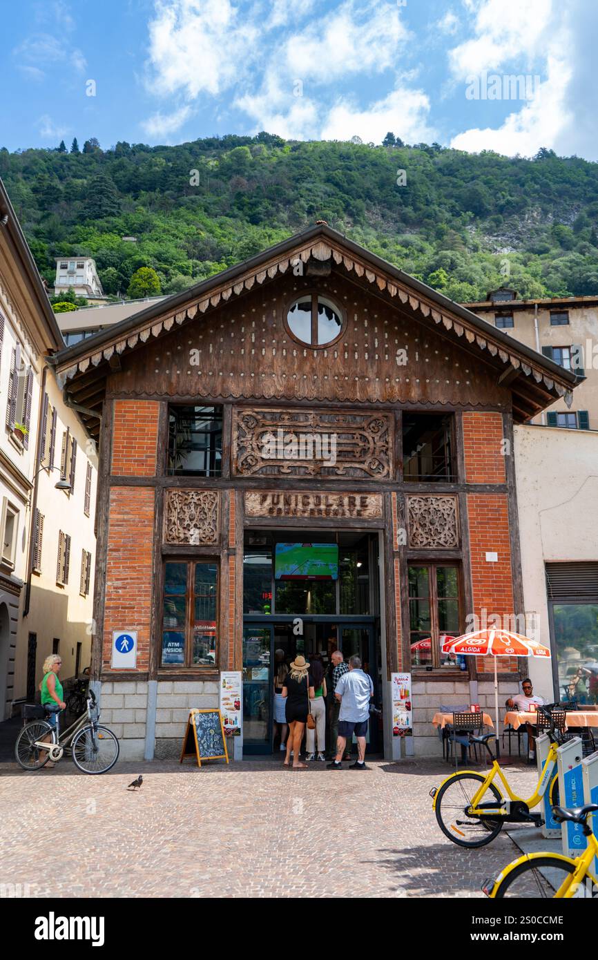A charming wooden and brick funicular station entrance with intricate ...