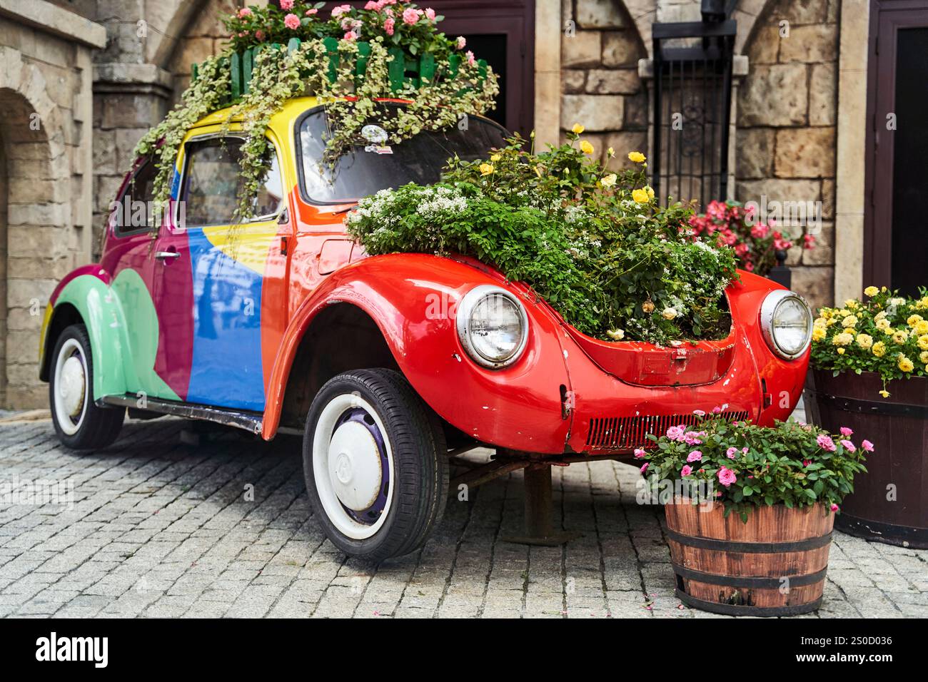 Vintage car decorated with flowers in the photo zone in a romantic ...