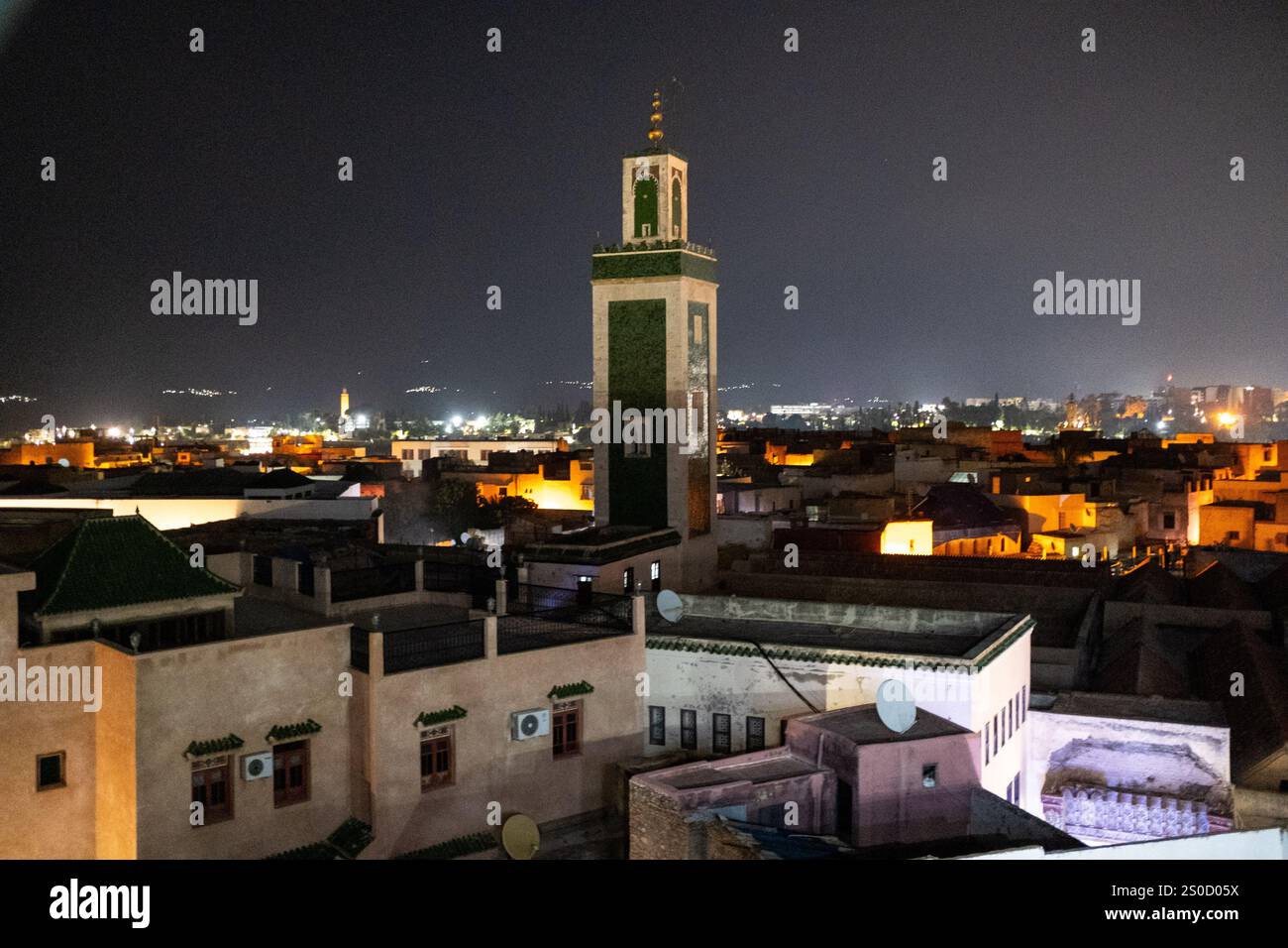 Landscape in the medina in Meknes with the minaret of the Great Mosque ...