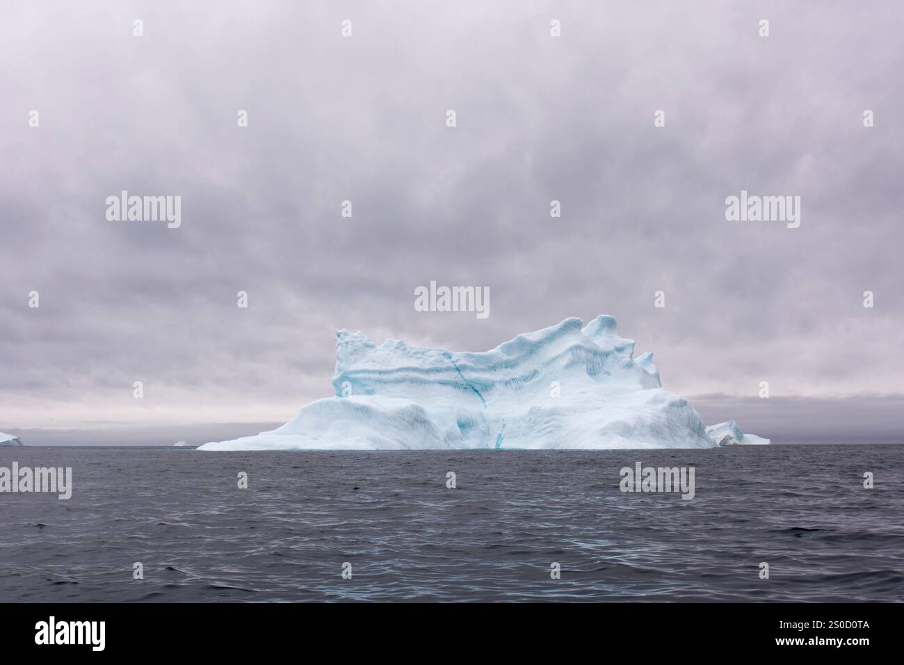 This stunning image captures a magnificent iceberg floating in the ...