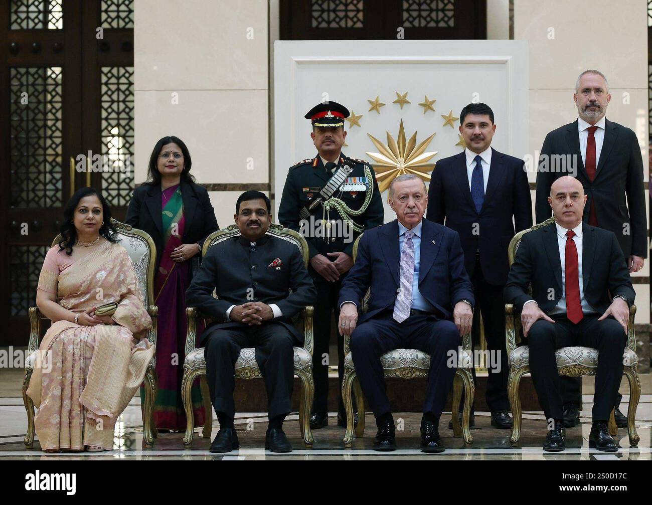 Turkish President Recep Tayyip Erdogan receives a copy of the credentials of Kumar Pardeshi, the ...