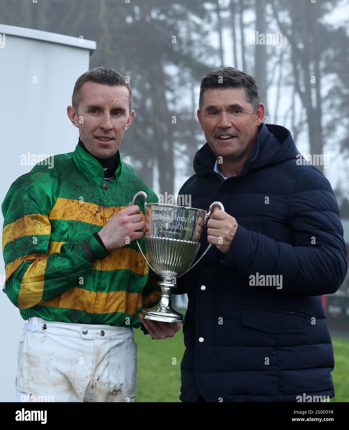 Jockey Mark Walsh receives the Paddy Power Chase Trophy from Golfer ...