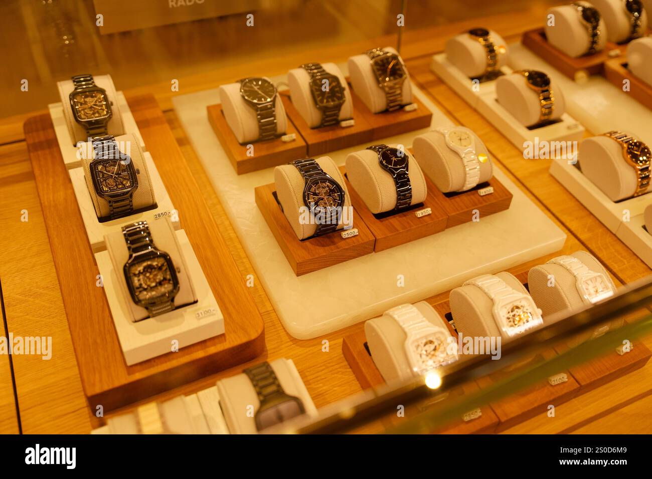 Display of luxury watches in a retail store featuring various styles ...