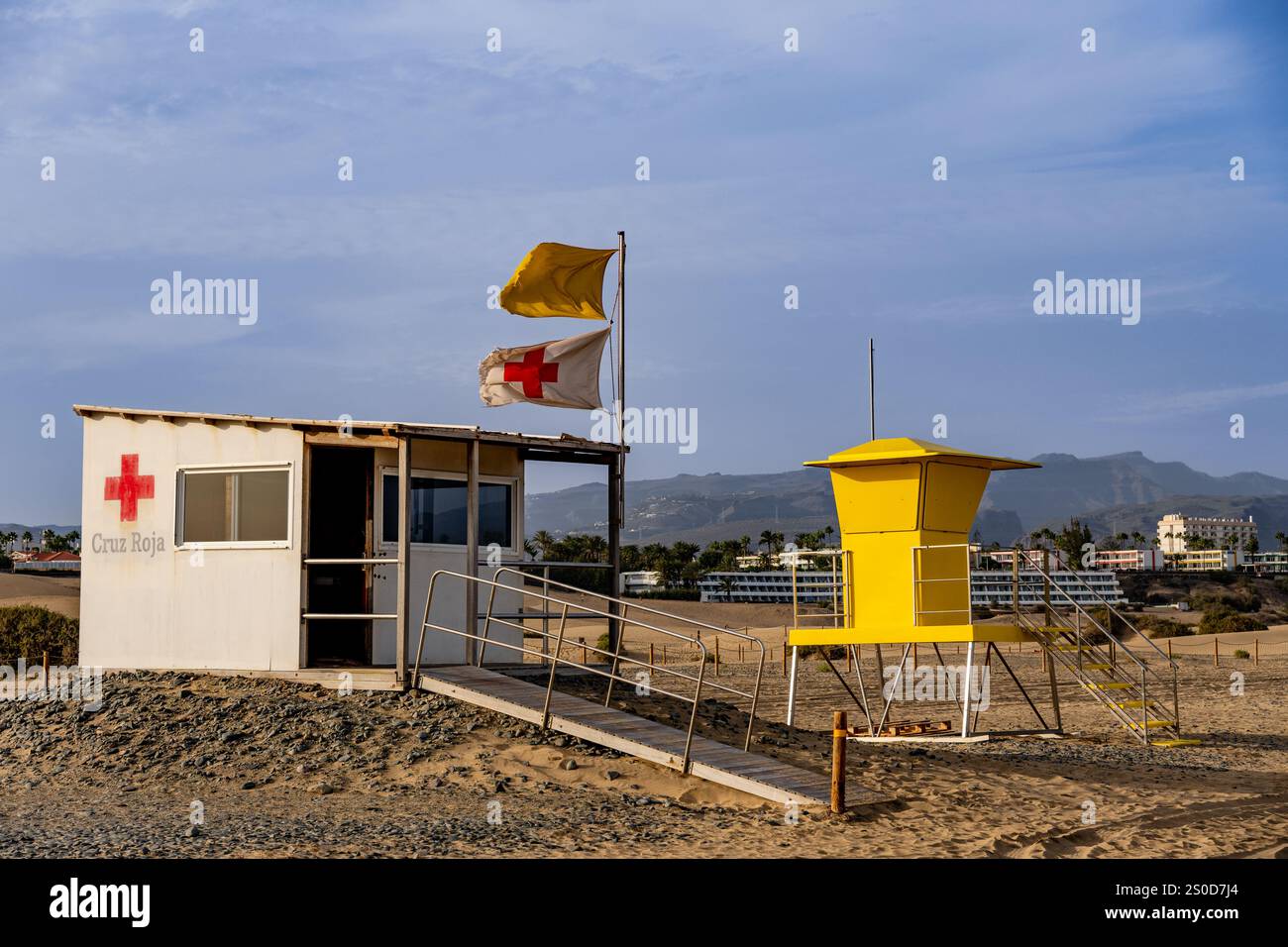 Scenic view of an iconic yellow lifeguard tower with yellow flag on ...