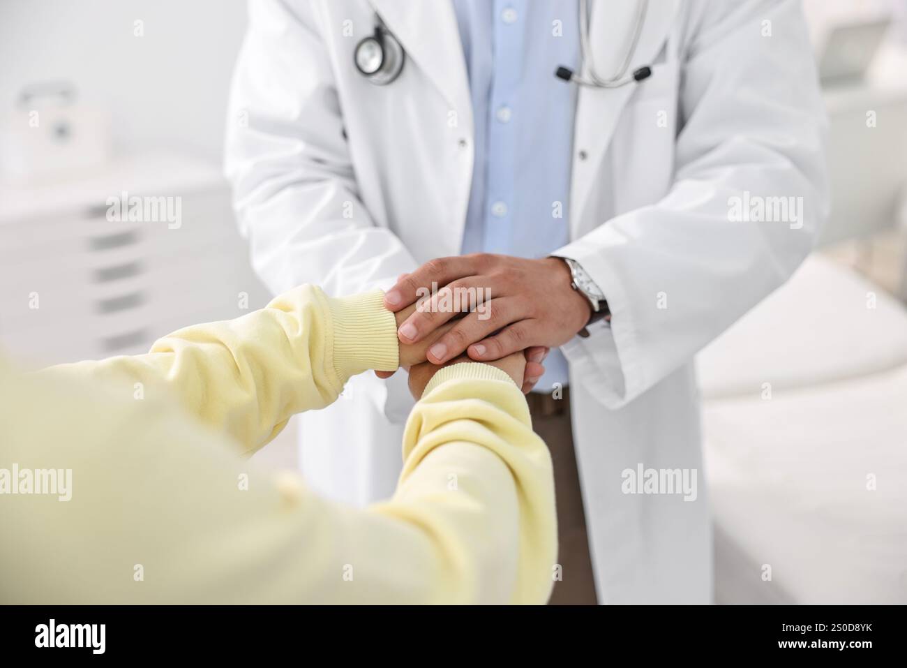 Healthcare worker supporting patient in hospital, closeup Stock Photo ...