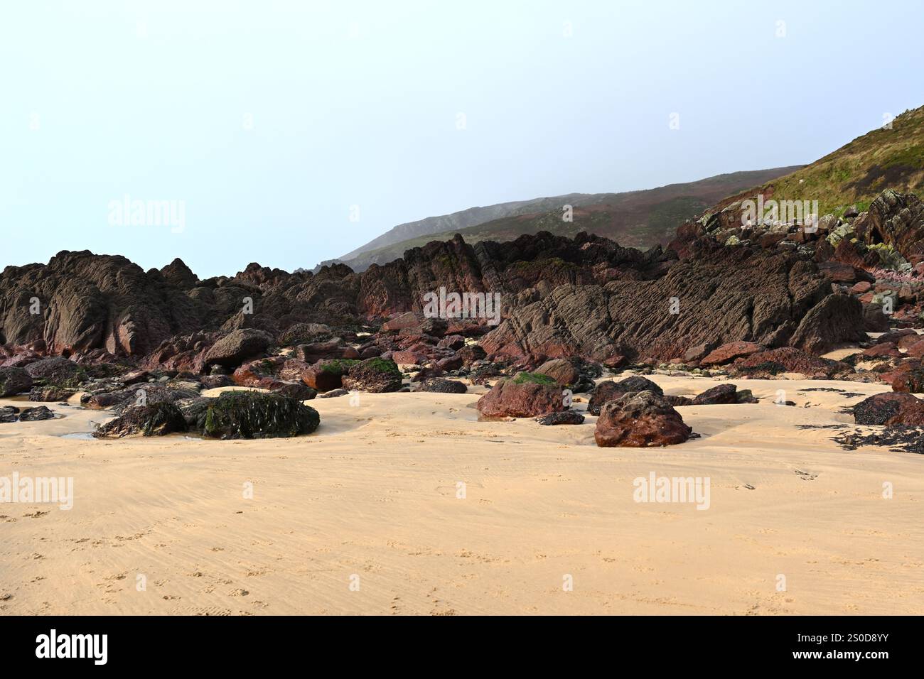 Two tone red and grey green rock formations on the beach at Freshwater ...