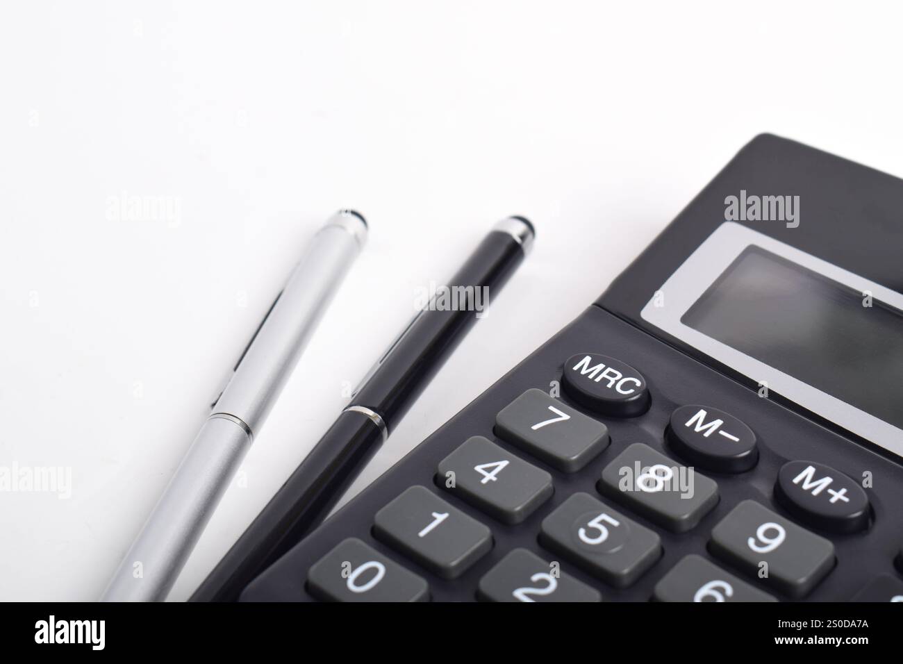 Black Calculator with pen isolated on white background. Financial ...