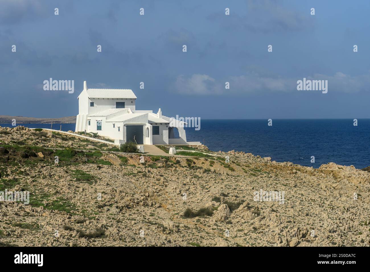A traditional white Menorcan house featuring Mediterranean-style ...