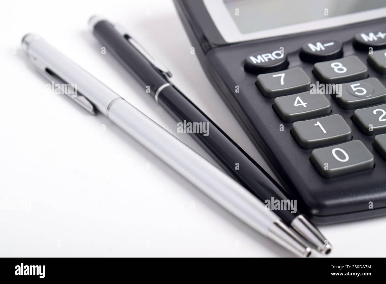 Black Calculator with pen isolated on white background. Financial ...