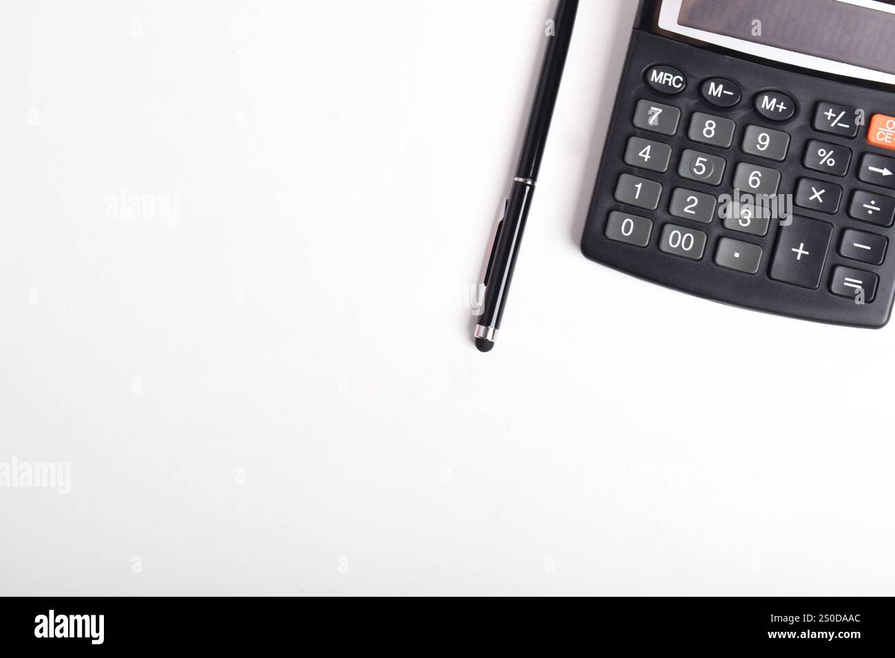 Black Calculator with pen isolated on white background. Financial ...