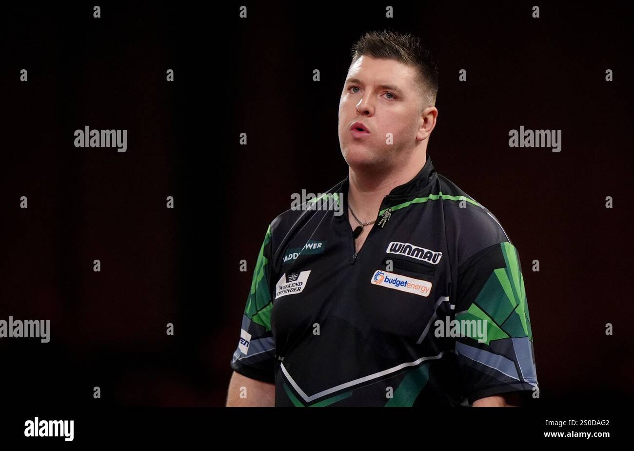 Daryl Gurney reacts during his third round match against Jonny Clayton ...