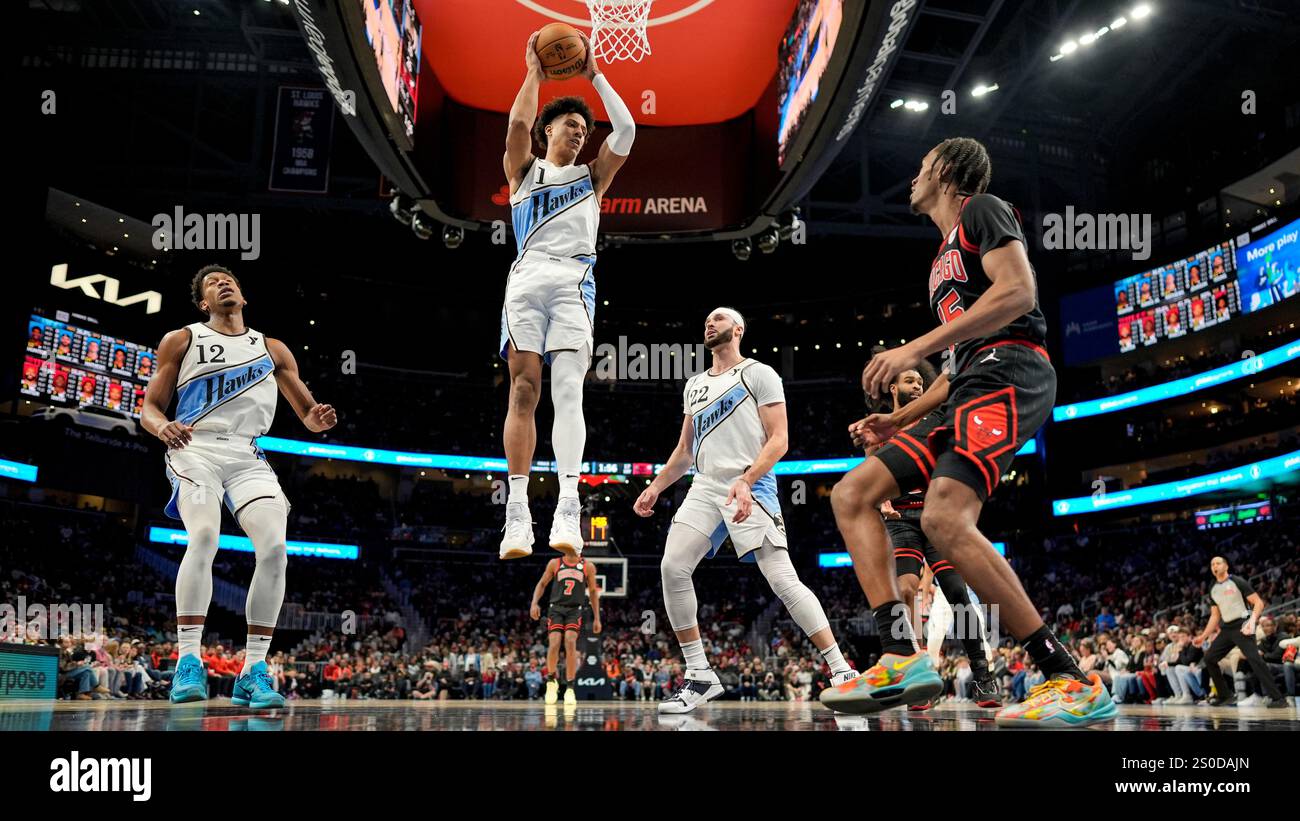 Atlanta Hawks forward Jalen Johnson (1) grabs the rebound from Chicago ...
