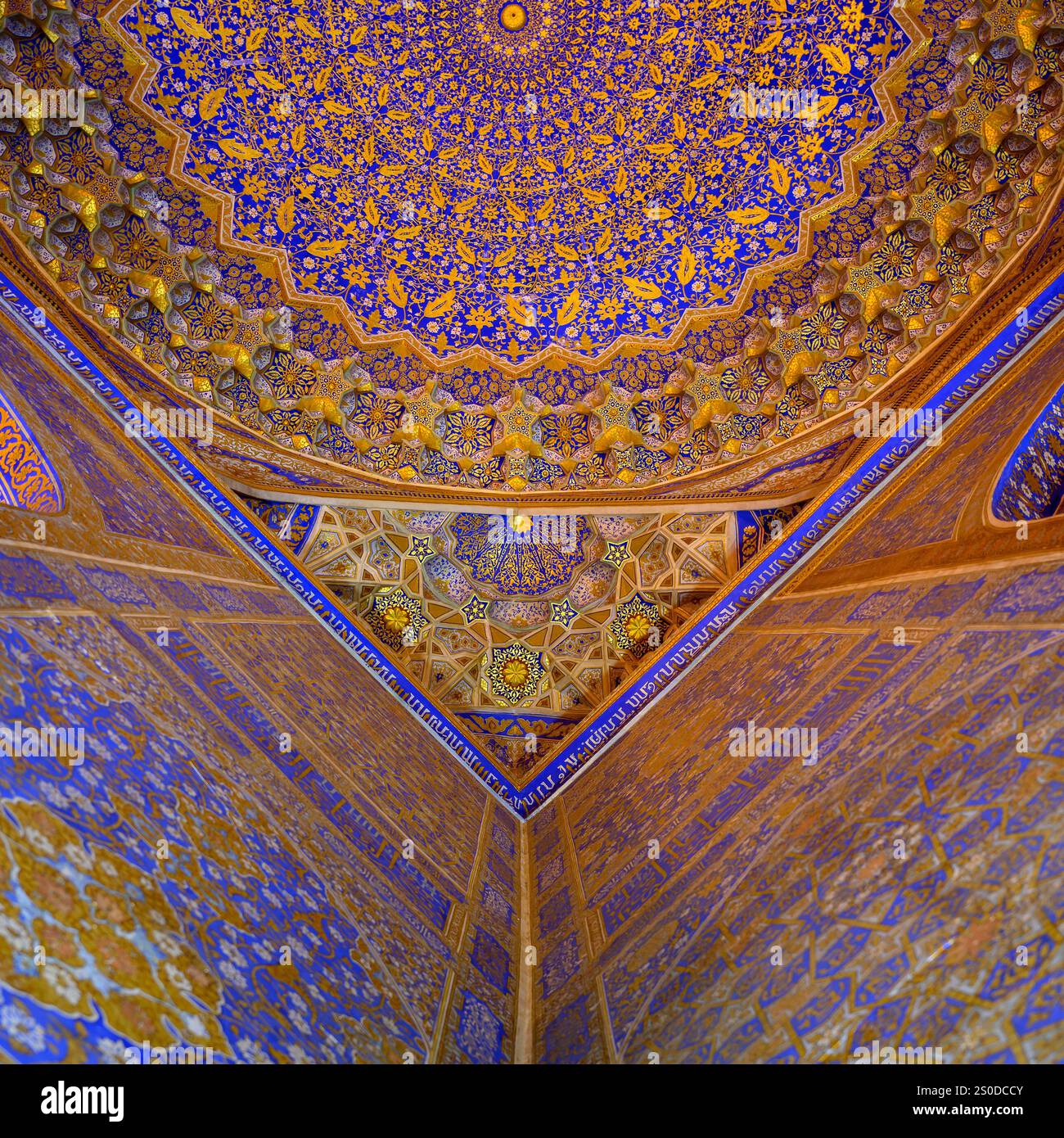 An inside view of the dome with golden-and-blue patterns in the Tillya ...