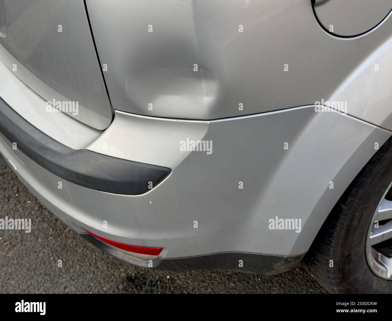 Large dent on a car after an accident Stock Photo - Alamy