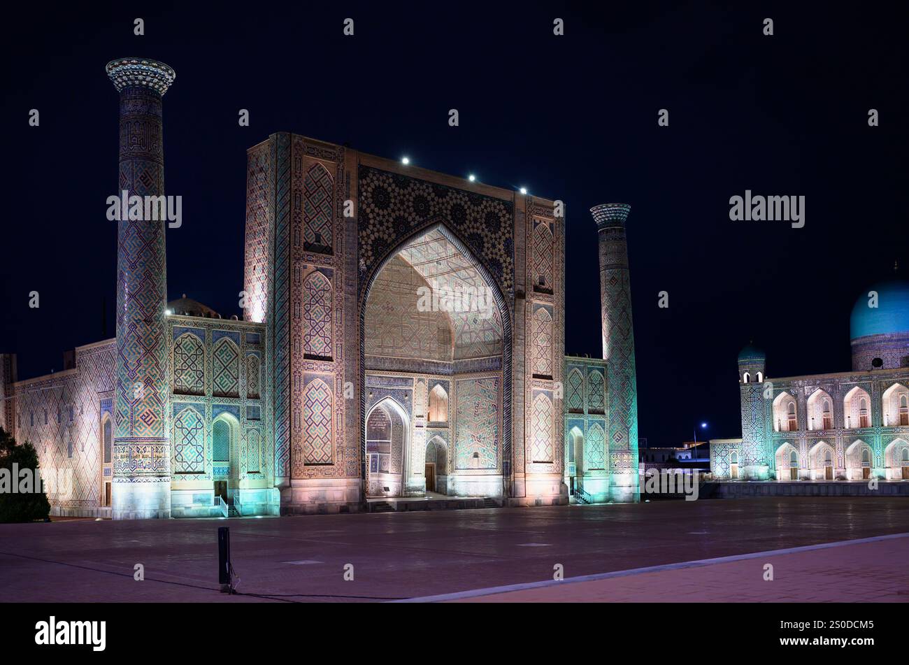 Night view of the 15th century Ulugbek Madrasah decorated with gold, majolica and mosaics in ...