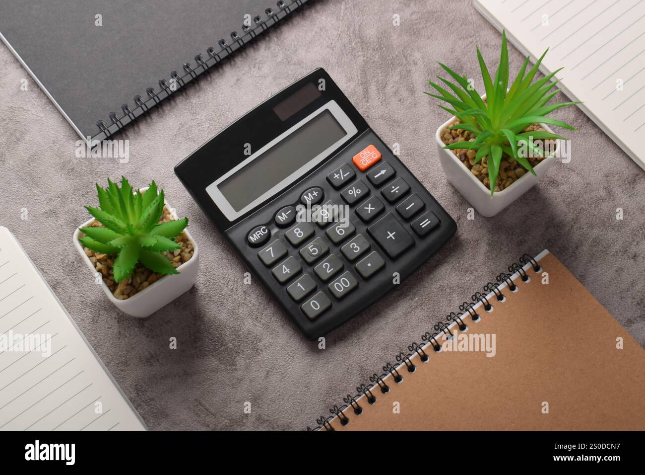 Bookkeeping workplace concept. Top view of Calculator, notebook and ...