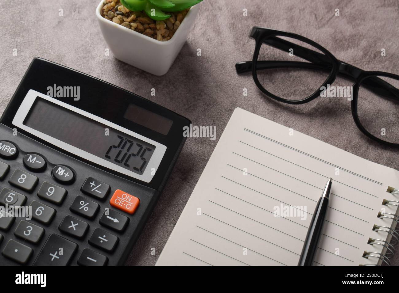 Budget concept for the next year. Calculator 2025 isolated on a dark ...