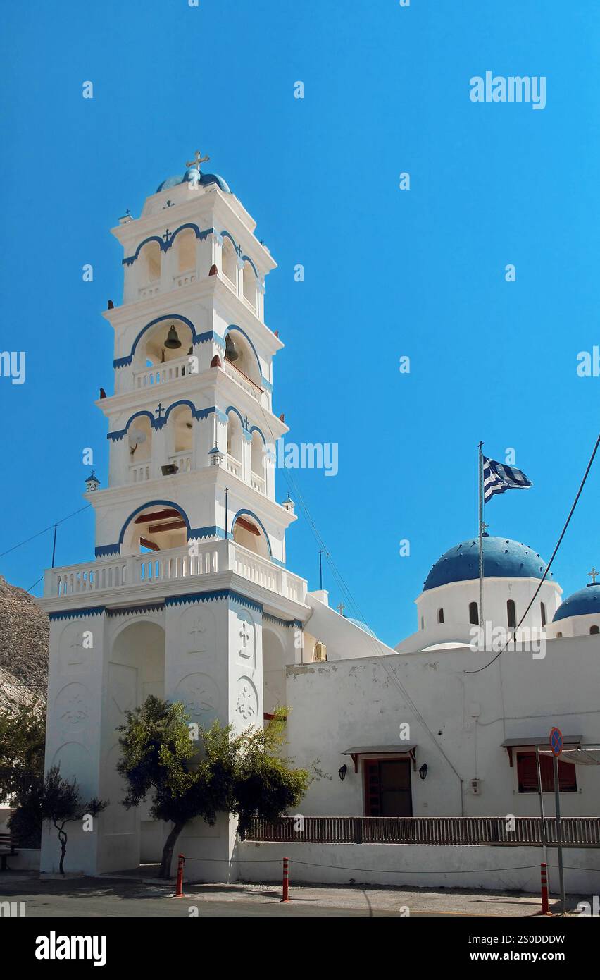 The church of Holy Cross in Perissa with the Greek flag. Greek Orthodox ...