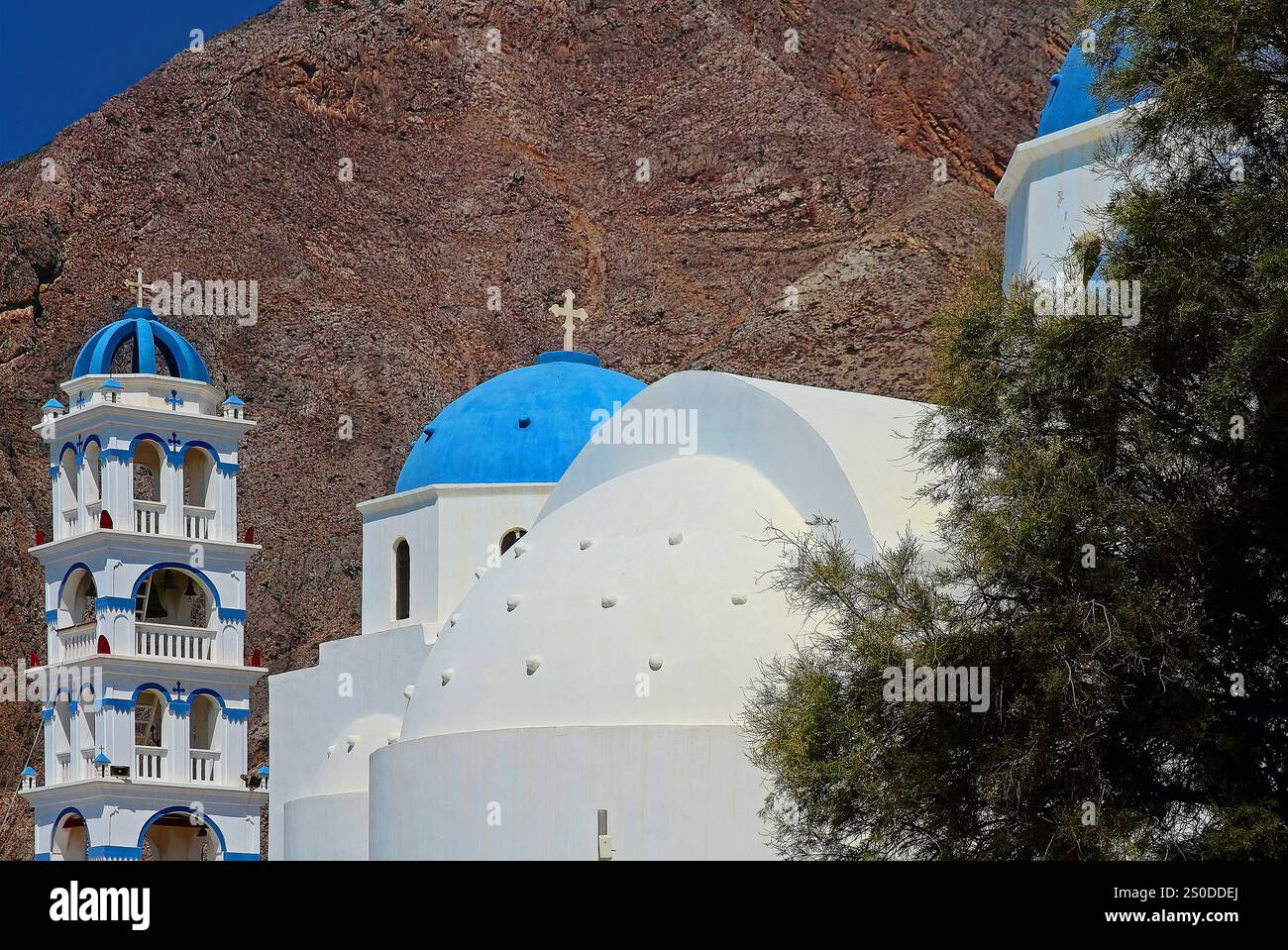 Blue domes and Belfry of the church of Holy Cross in Perissa on a Mesa ...