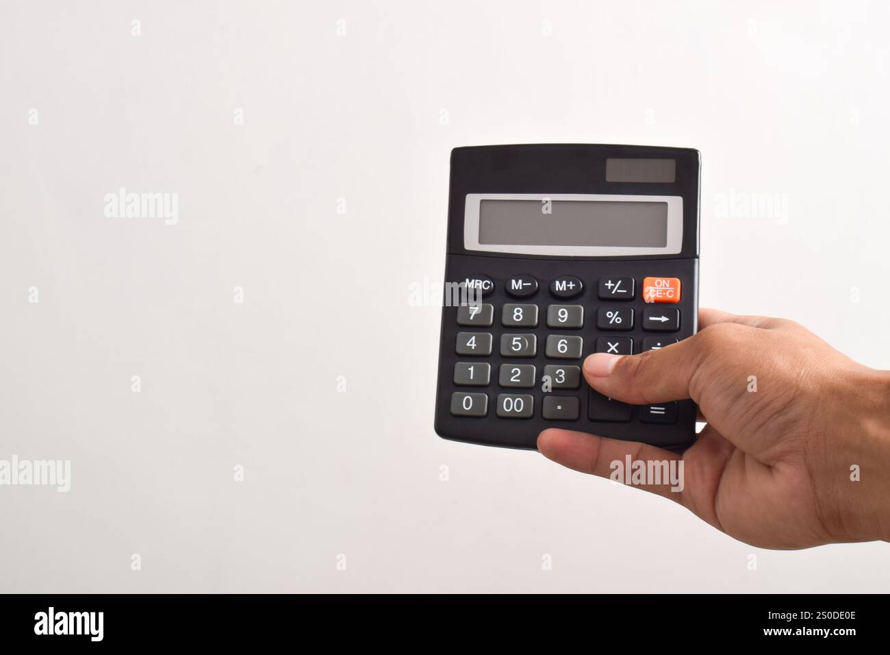 Hand hold calculator isolated on white background Stock Photo - Alamy