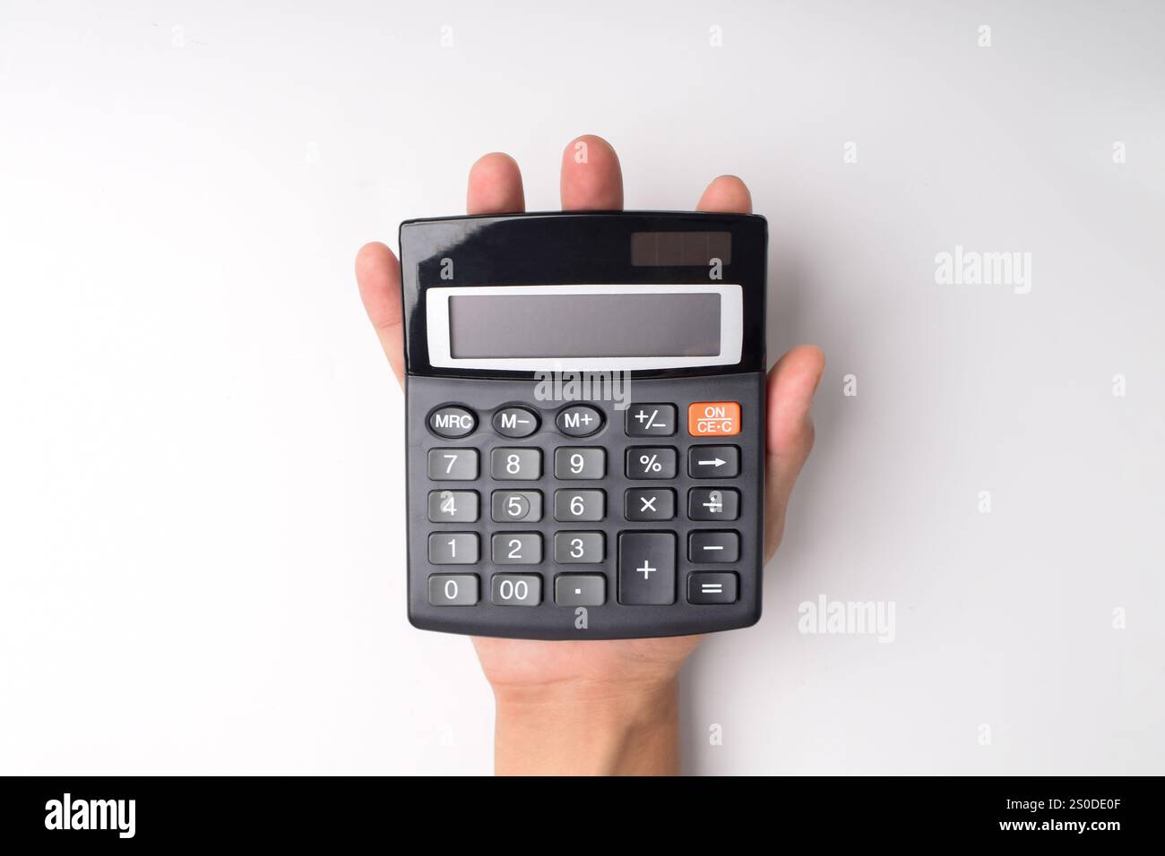 Hand hold calculator isolated on white background Stock Photo - Alamy