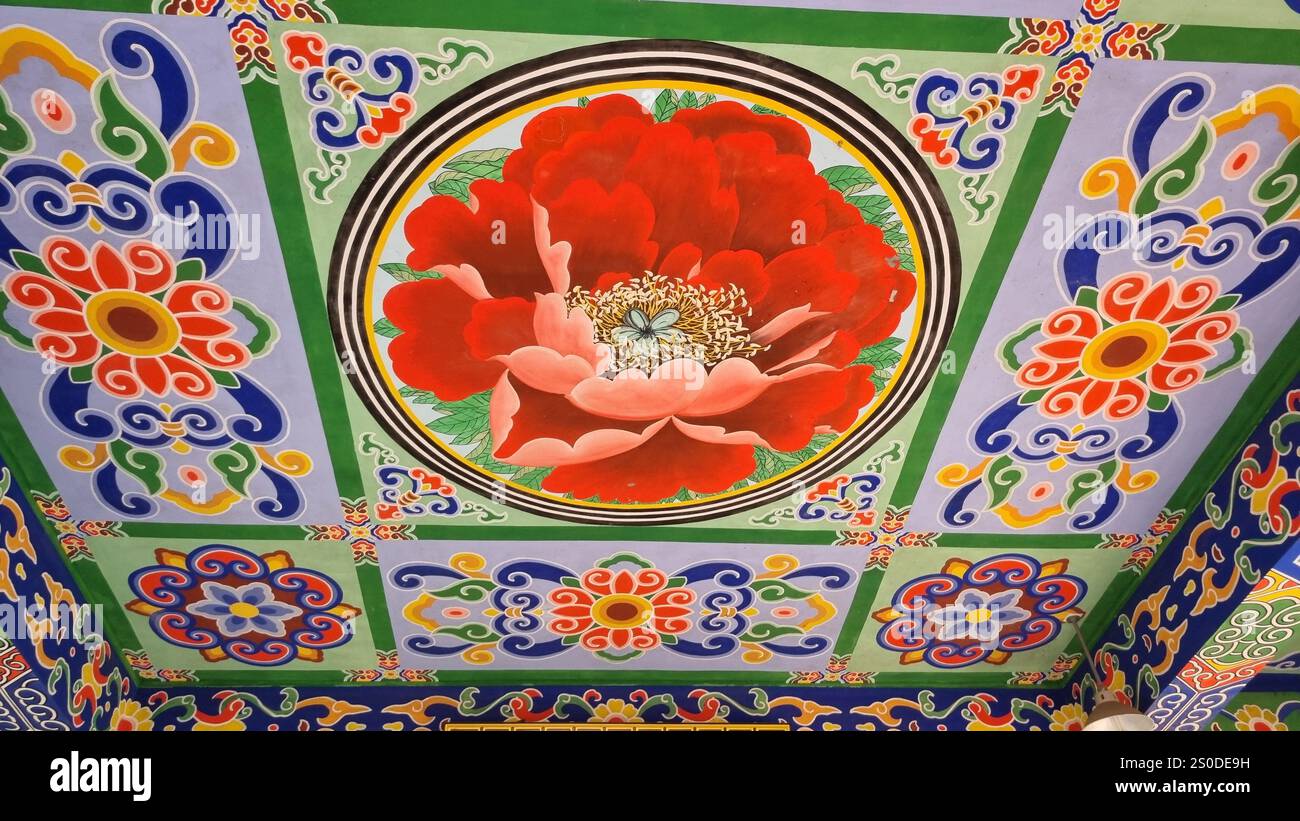 A beautifully painted ceiling showcasing a vivid red peony surrounded ...