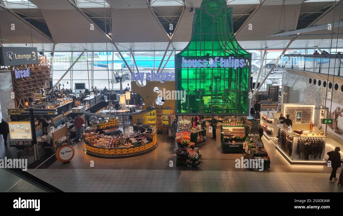 A lively scene inside Amsterdam's Schiphol Airport in the Netherlands ...