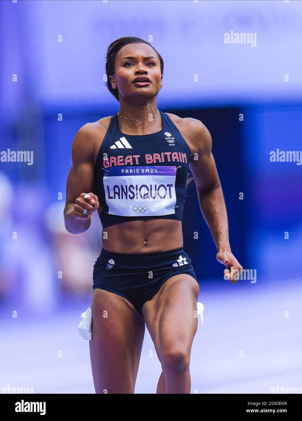 Imani-Lara Lansiquot participating in the 100 meters at the Paris 2024 ...