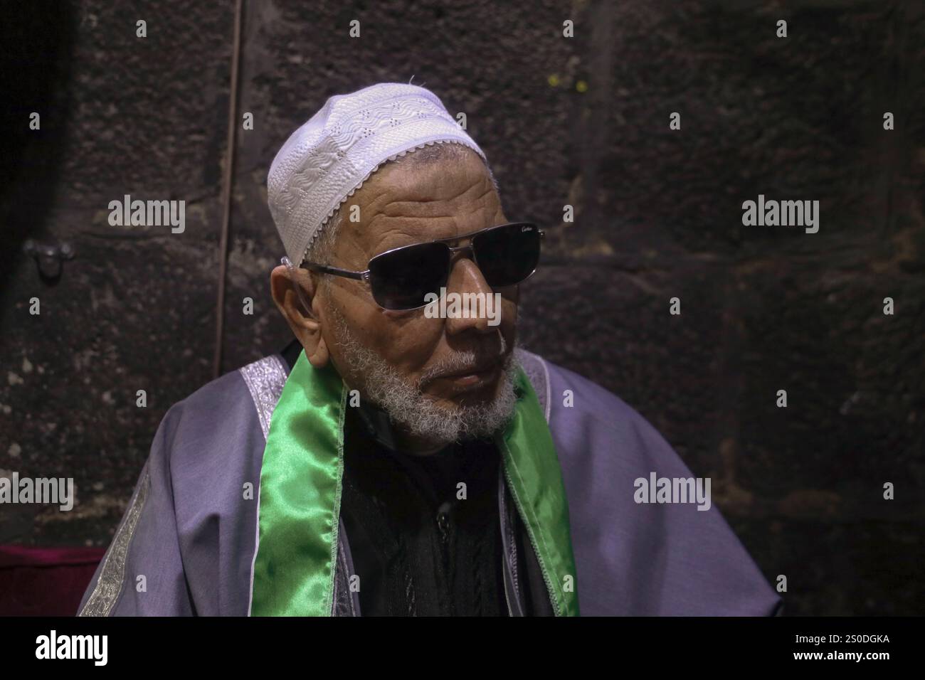 Sheikh Ahmed Eid Al-Sayasneh sits during prayers after speaking from the pulpit of the Omari ...
