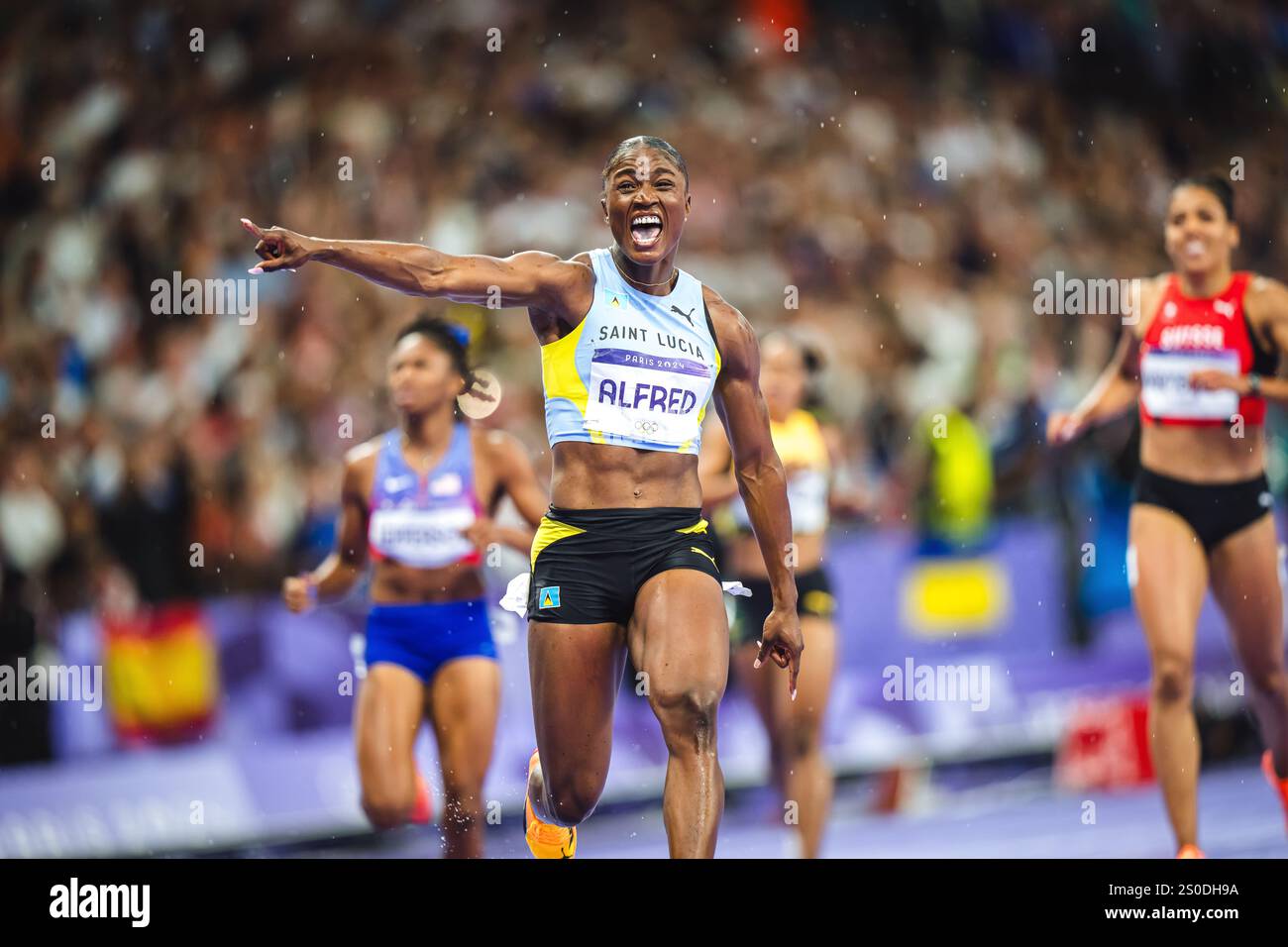Julien Alfred winning in the 100 meters relay at the Paris 2024 Olympic ...