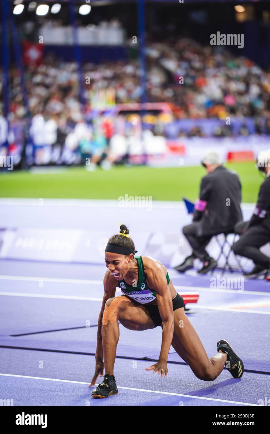 Thea LaFond celebrating her medal with her country's flag at the Paris ...